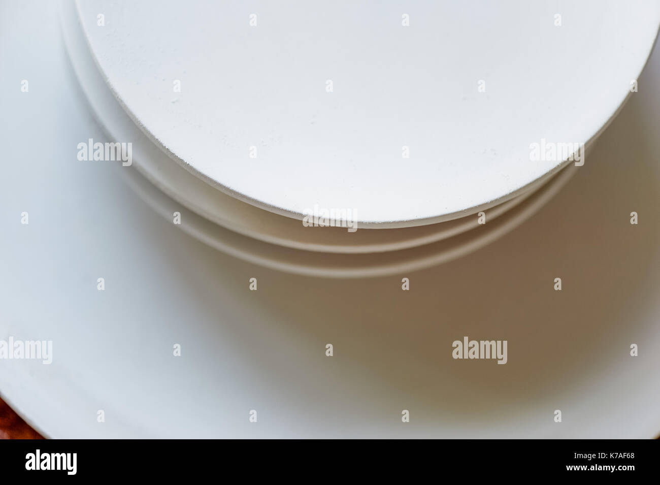 Set of white dishes isolated on white.Stack of plates Stock Photo - Alamy