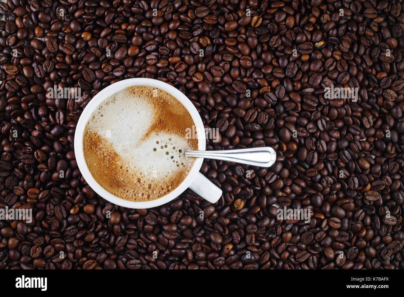 Coffee cup and coffee beans. Top view Stock Photo - Alamy