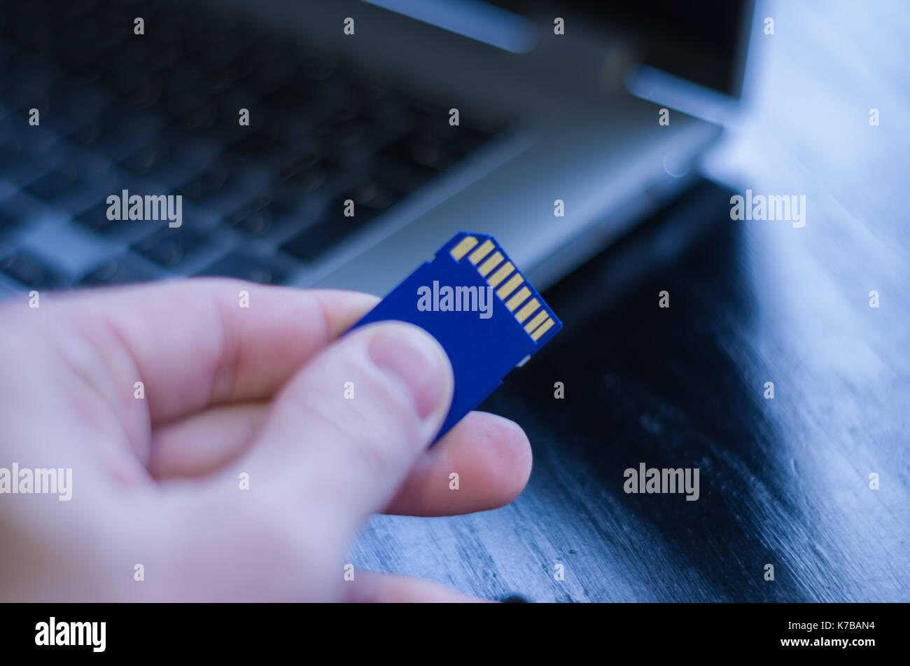 SD memory card on top of computer Stock Photo - Alamy