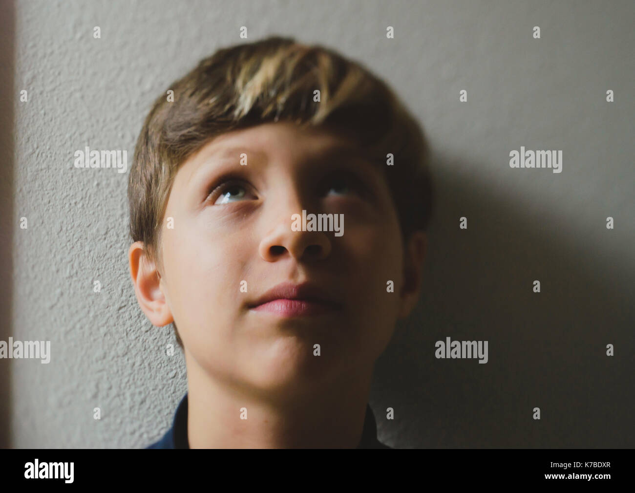 Boy looking at wall hi-res stock photography and images - Alamy
