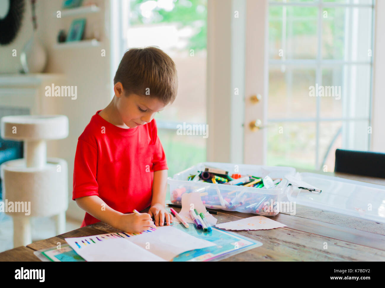 Boy drawing crayons hi-res stock photography and images - Alamy