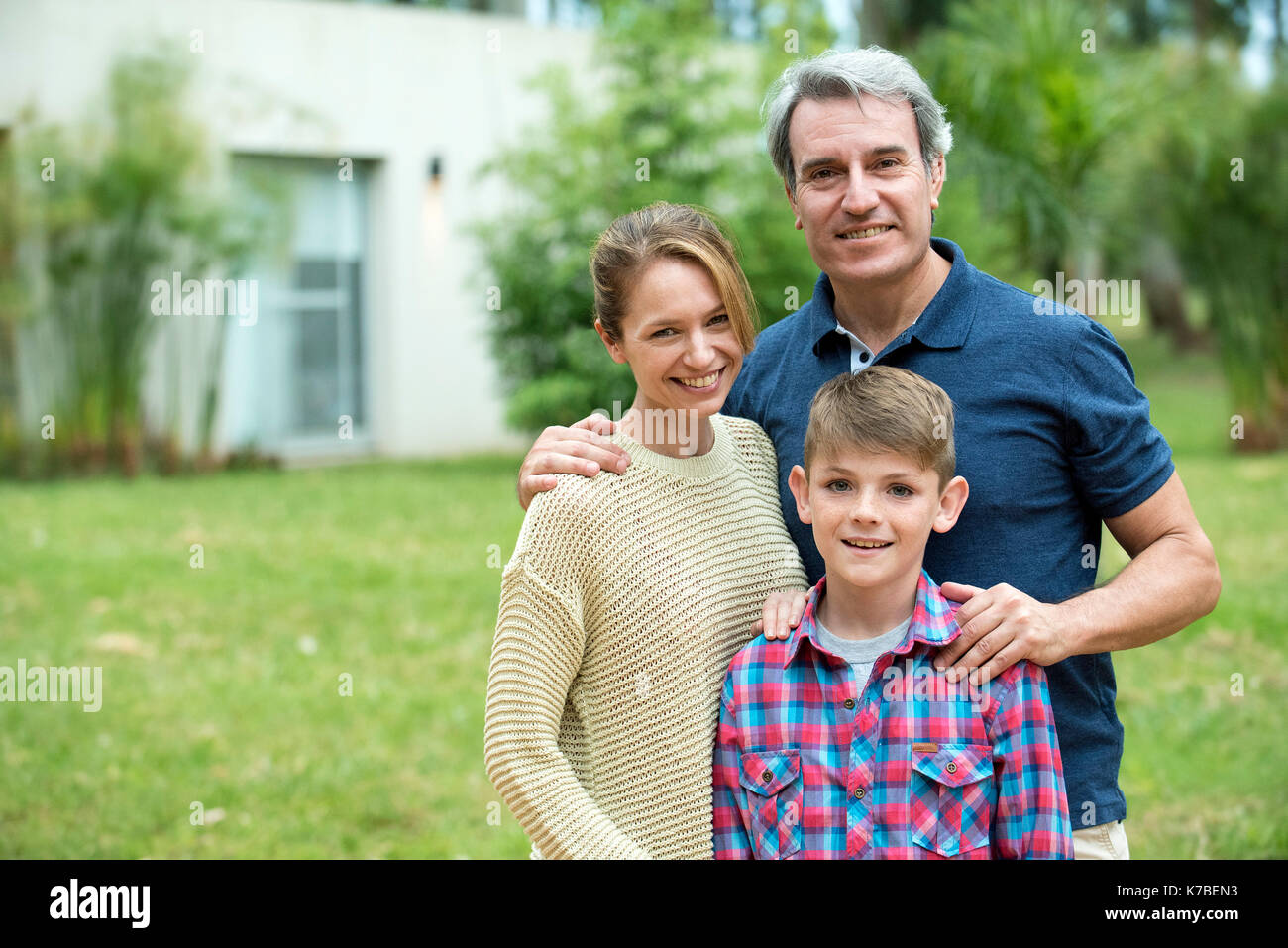 Family standing together outdoors, portrait Stock Photo - Alamy