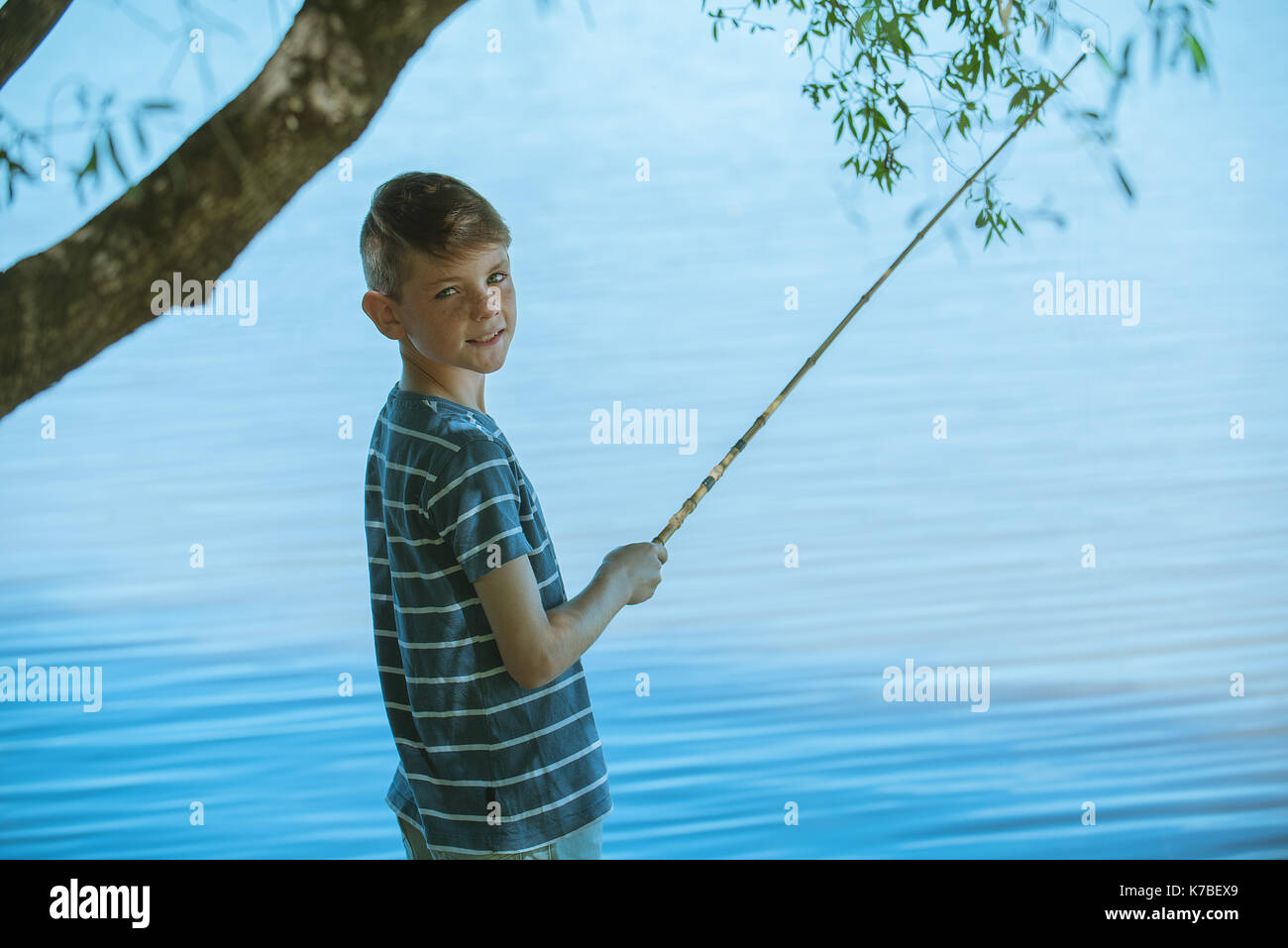 Boy fishing, portrait Stock Photo - Alamy