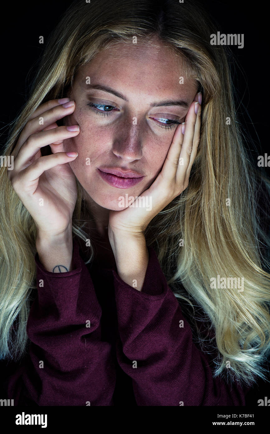 Leaning on the chin with both hands hi-res stock photography and images ...