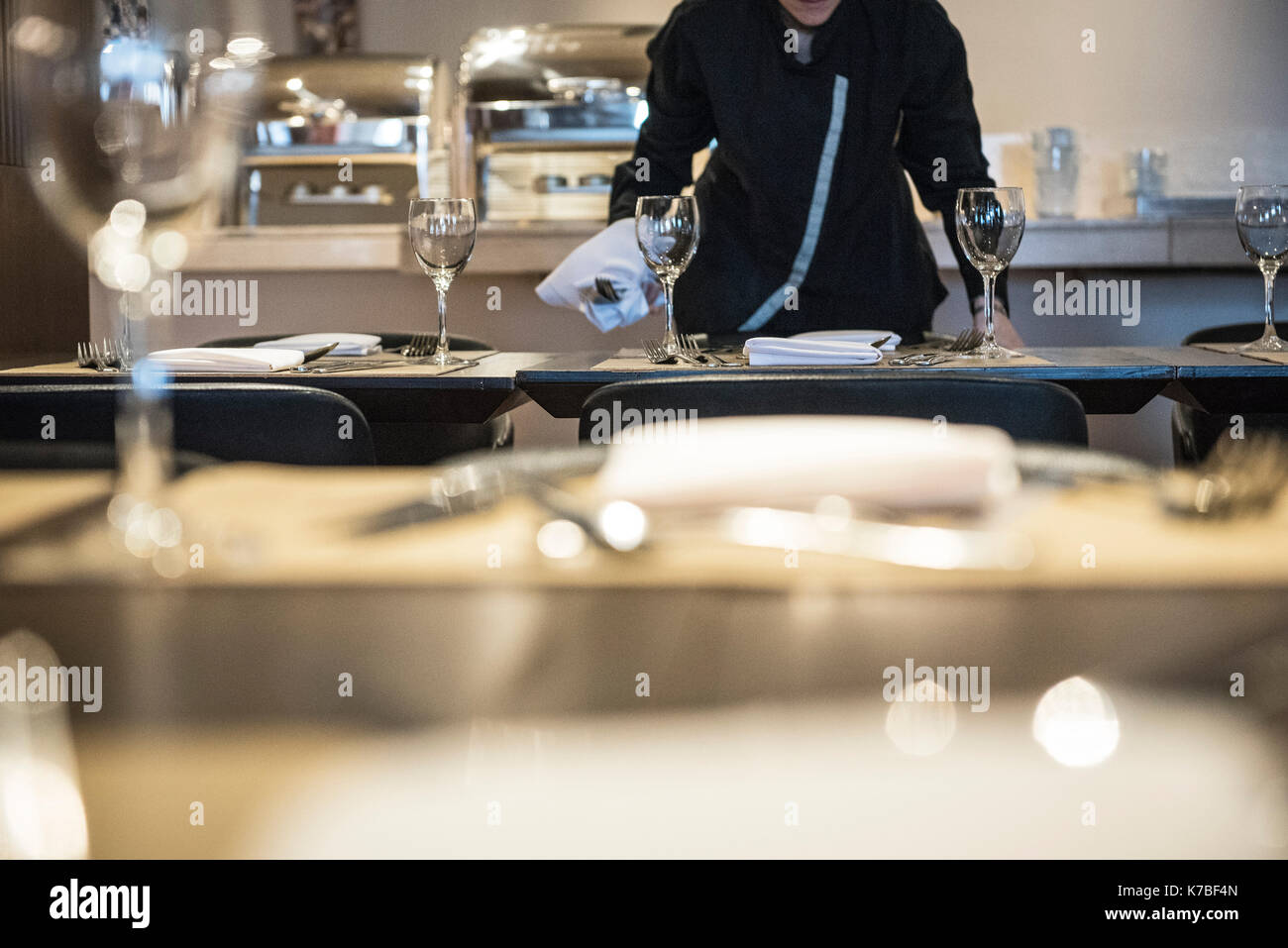Young women setting table hi-res stock photography and images - Alamy