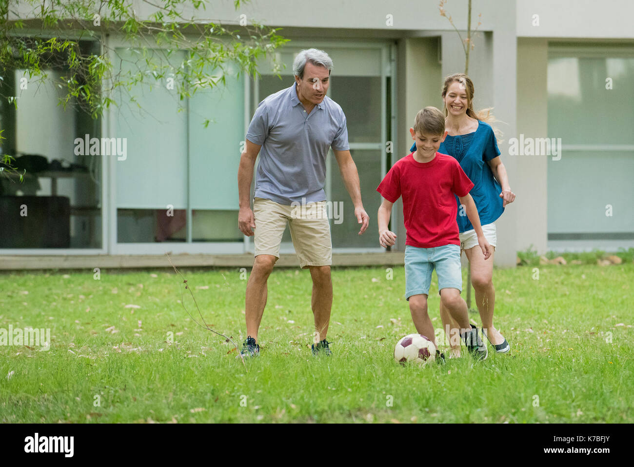 Family playing soccer together hi-res stock photography and images - Alamy