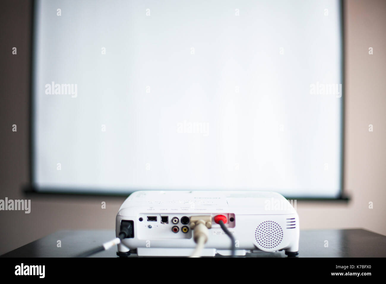 Video projector and blank screen in office or classroom Stock Photo - Alamy
