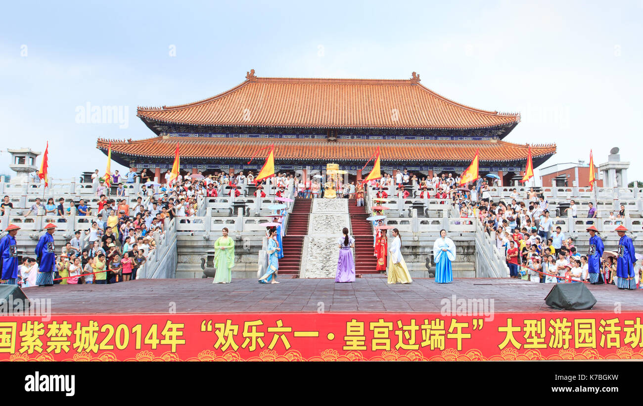 Xiamen, China - Jun 2, 2014: People watching show in front of palace ...
