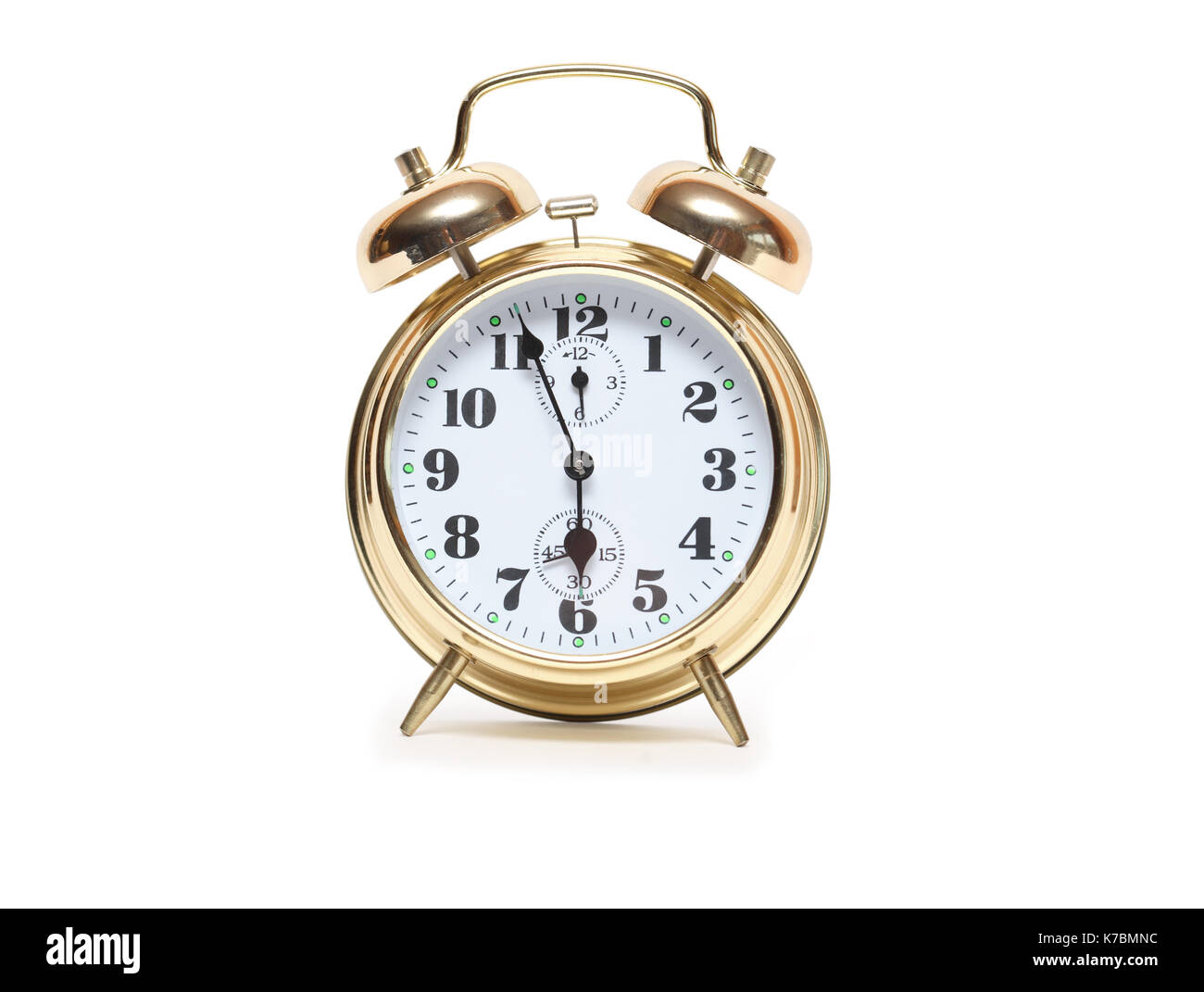 Nice gold alarm clock standing on white background. Clipping path is ...