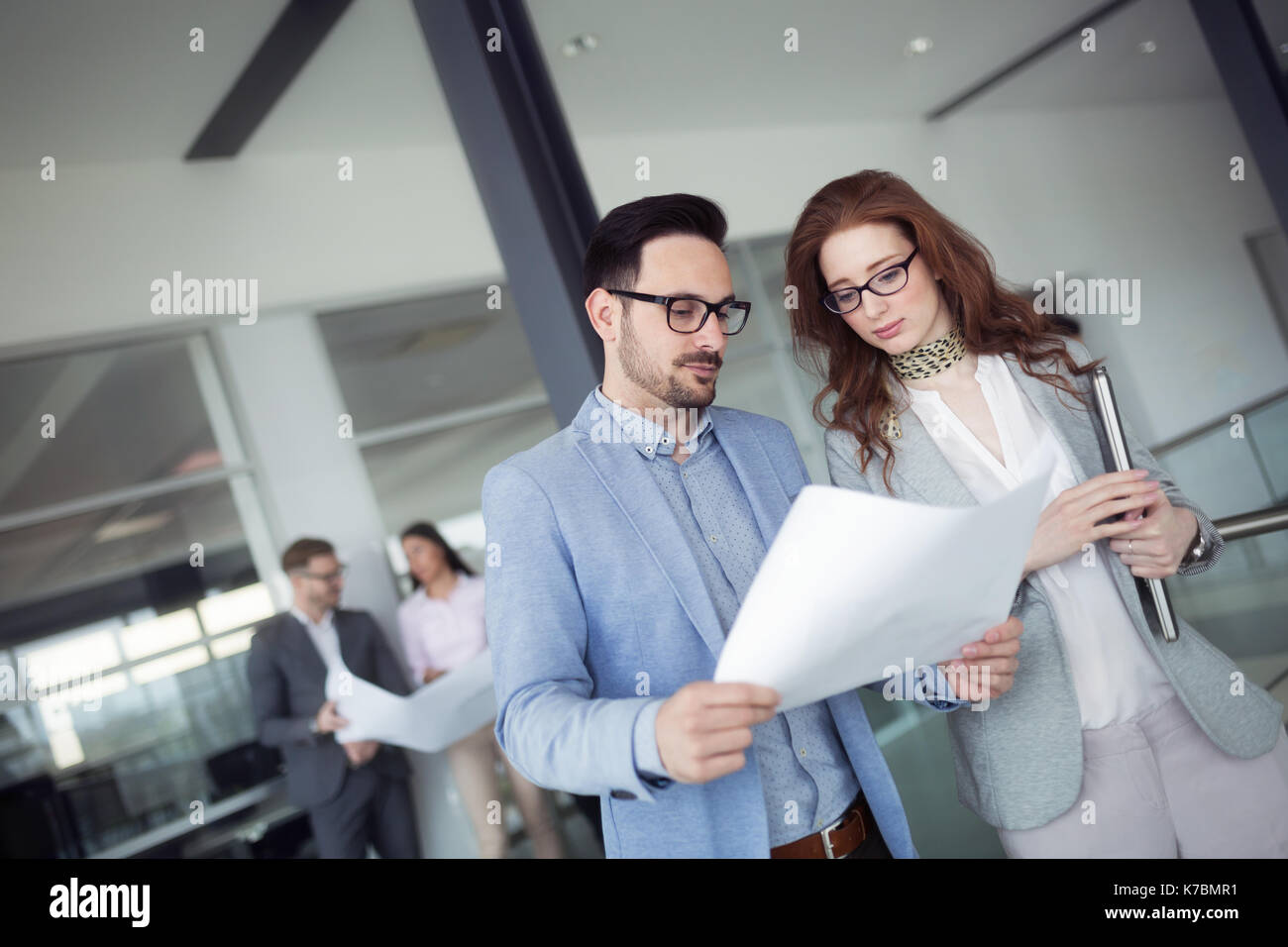 Professional colleagues collaborating in hi-res stock photography and ...
