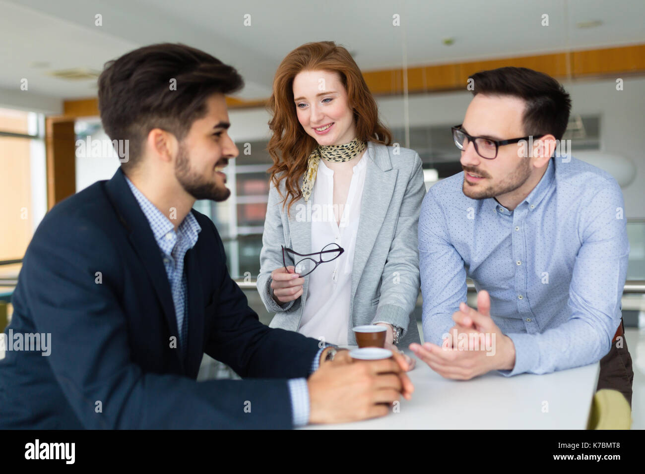 Business colleagues having conversation during coffee break Stock Photo ...