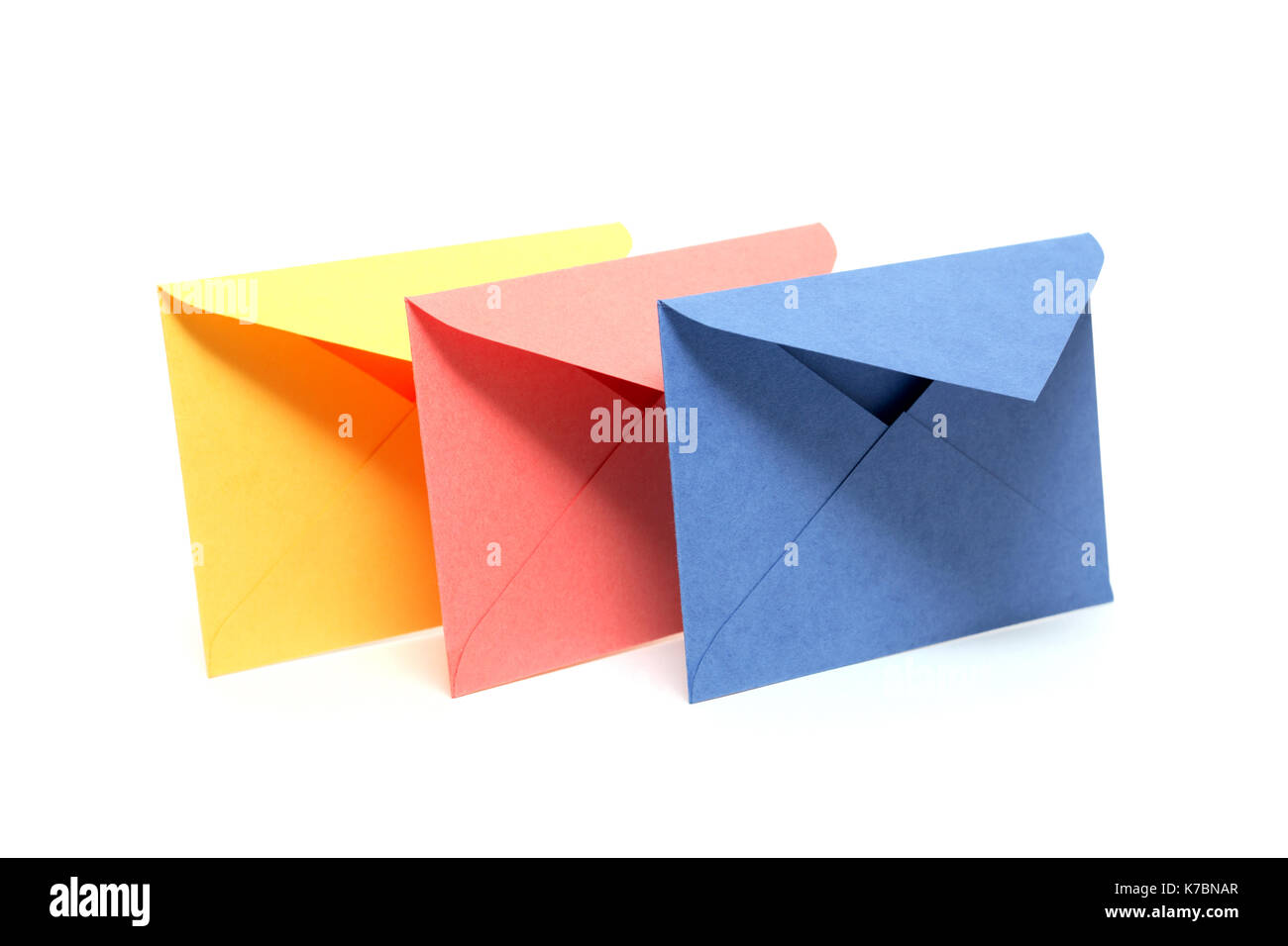 Colorful envelopes standing in a row on white background Stock Photo ...