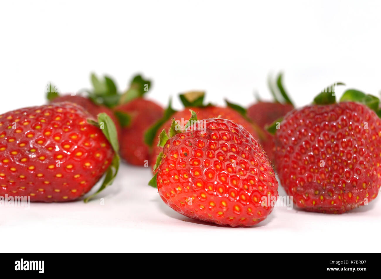 Frontal view of strawberries isolated on white background Stock Photo ...