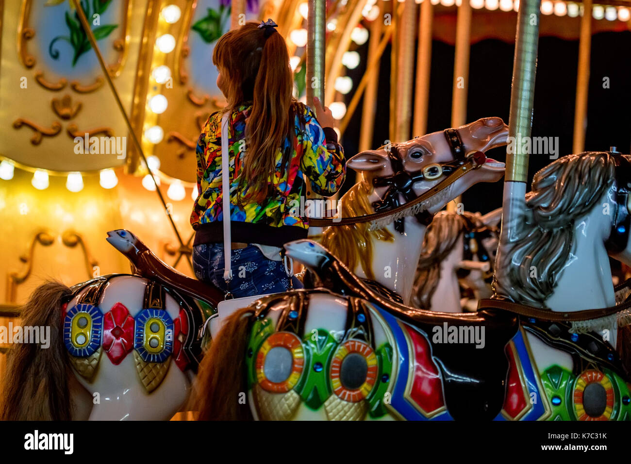 Carousel at fun fair Stock Photo - Alamy