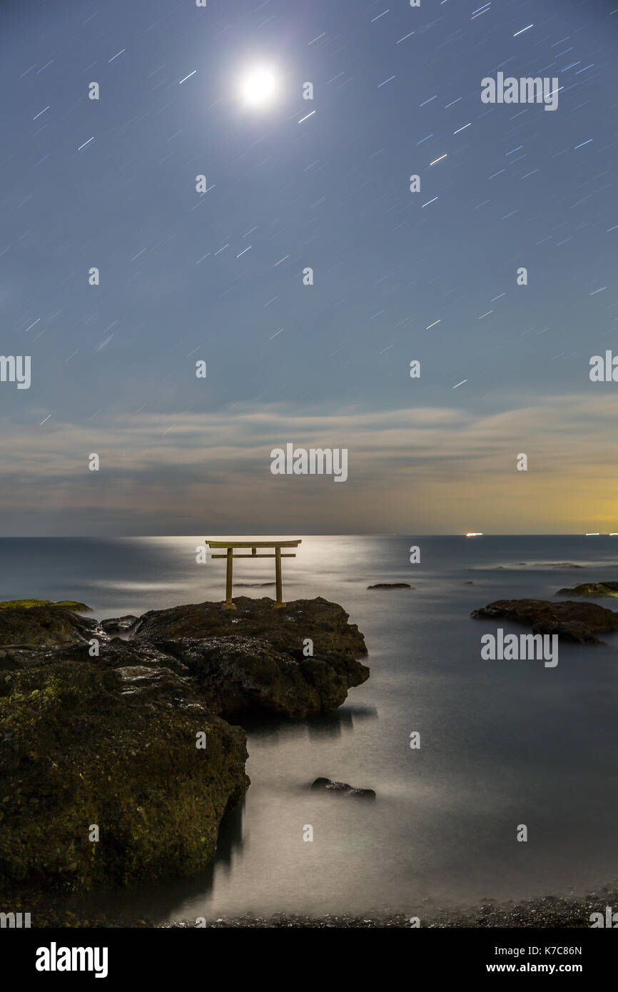 Toroii Japanese shrine gate sunrise at sea Oarai city , Ibaraki Japan ...