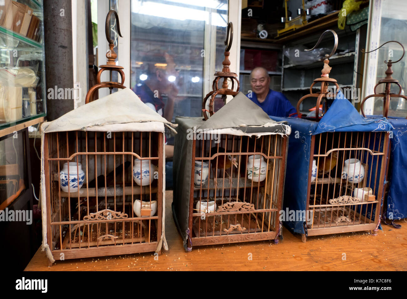 Chinese man with a bird cage hi-res stock photography and images - Alamy
