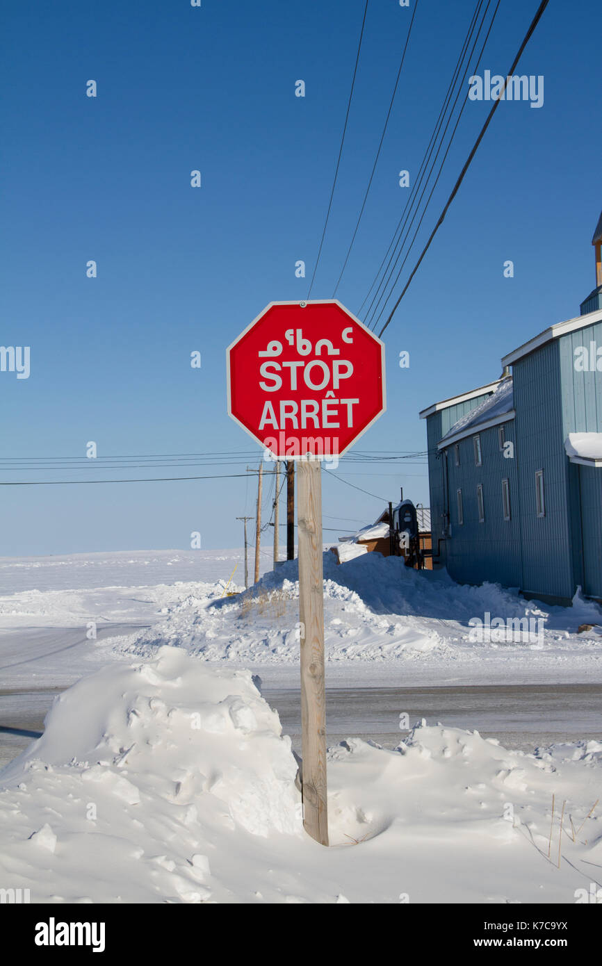 Octagon red stop sign with in Inuktitut (Syllabic), English and French ...