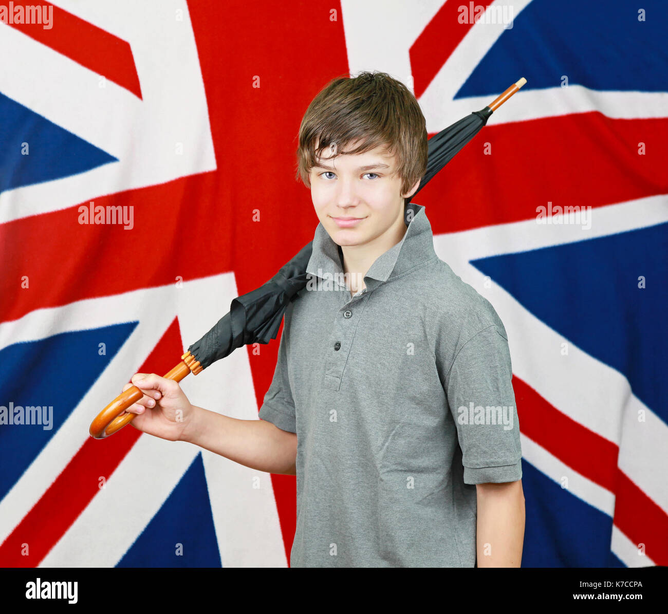 Young British boy with umbrella in front of Union Jack flag Stock Photo ...