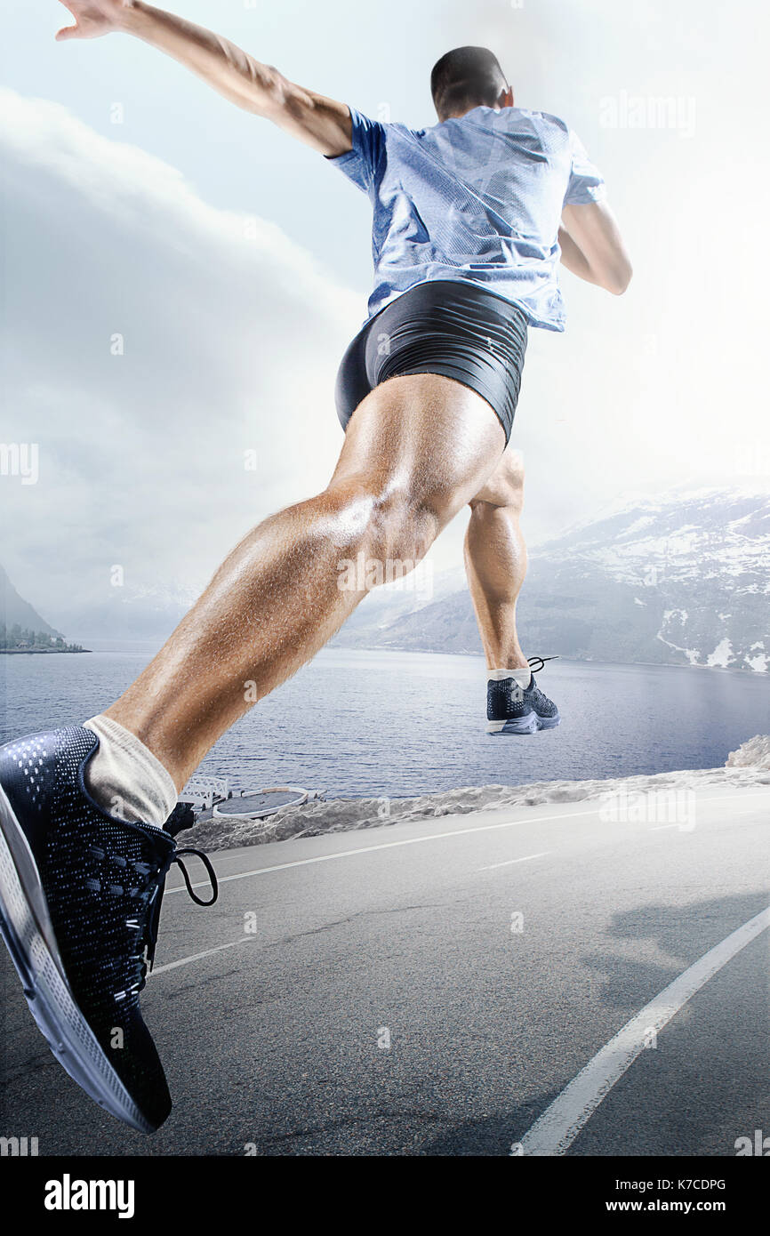 Sport backgrounds. Sprinter starting on the running track Stock Photo ...