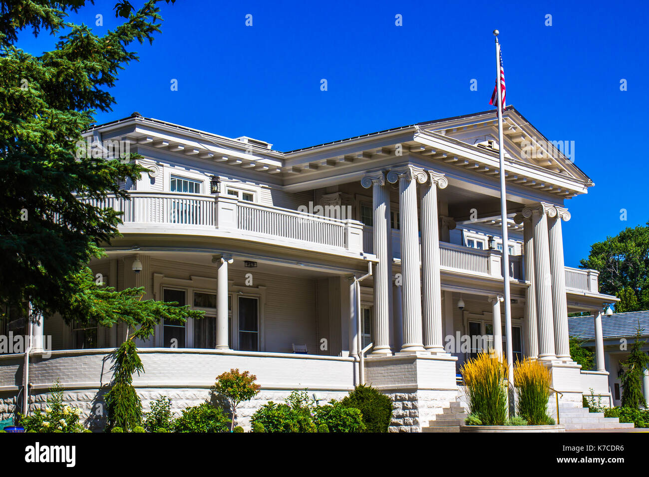 Classic Two Story Building With Wrap Around Porches Stock Photo - Alamy