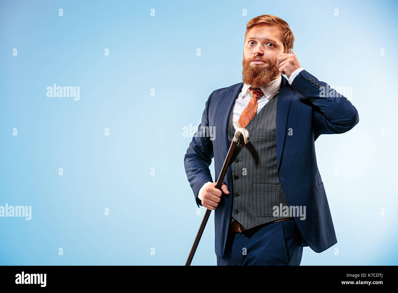 The barded man in a suit holding cane Stock Photo - Alamy