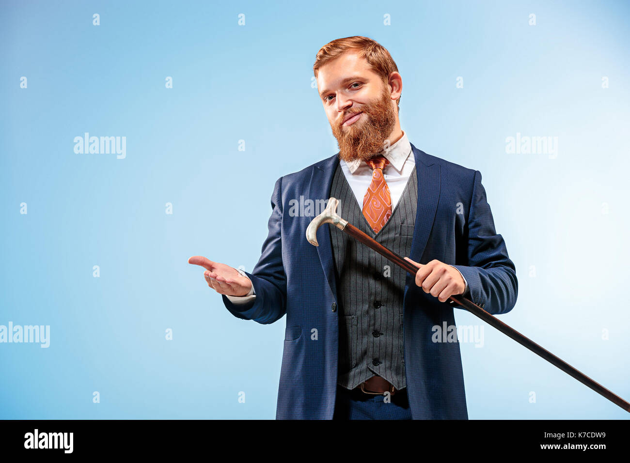 The barded man in a suit holding cane Stock Photo - Alamy