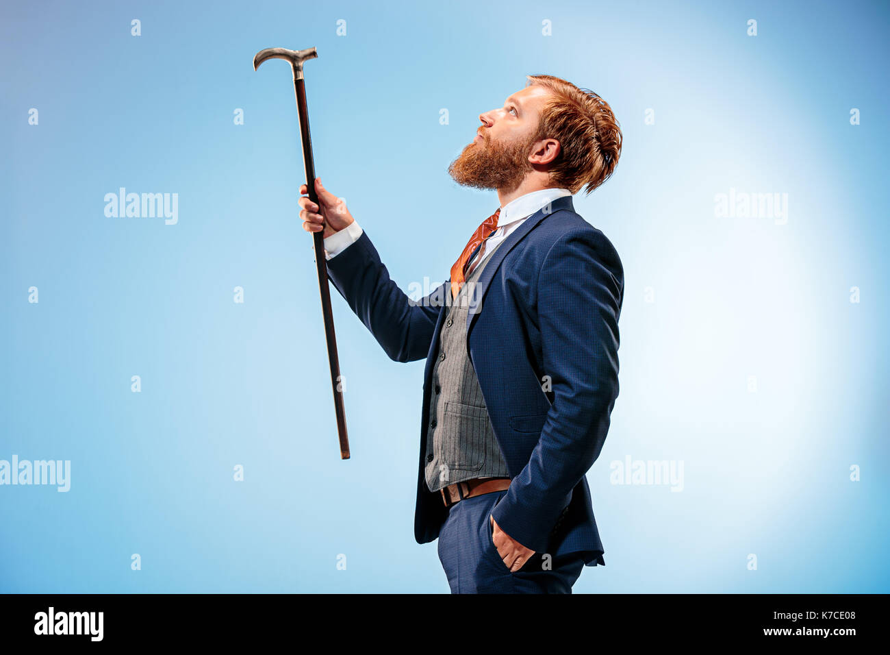 The barded man in a suit holding cane Stock Photo - Alamy
