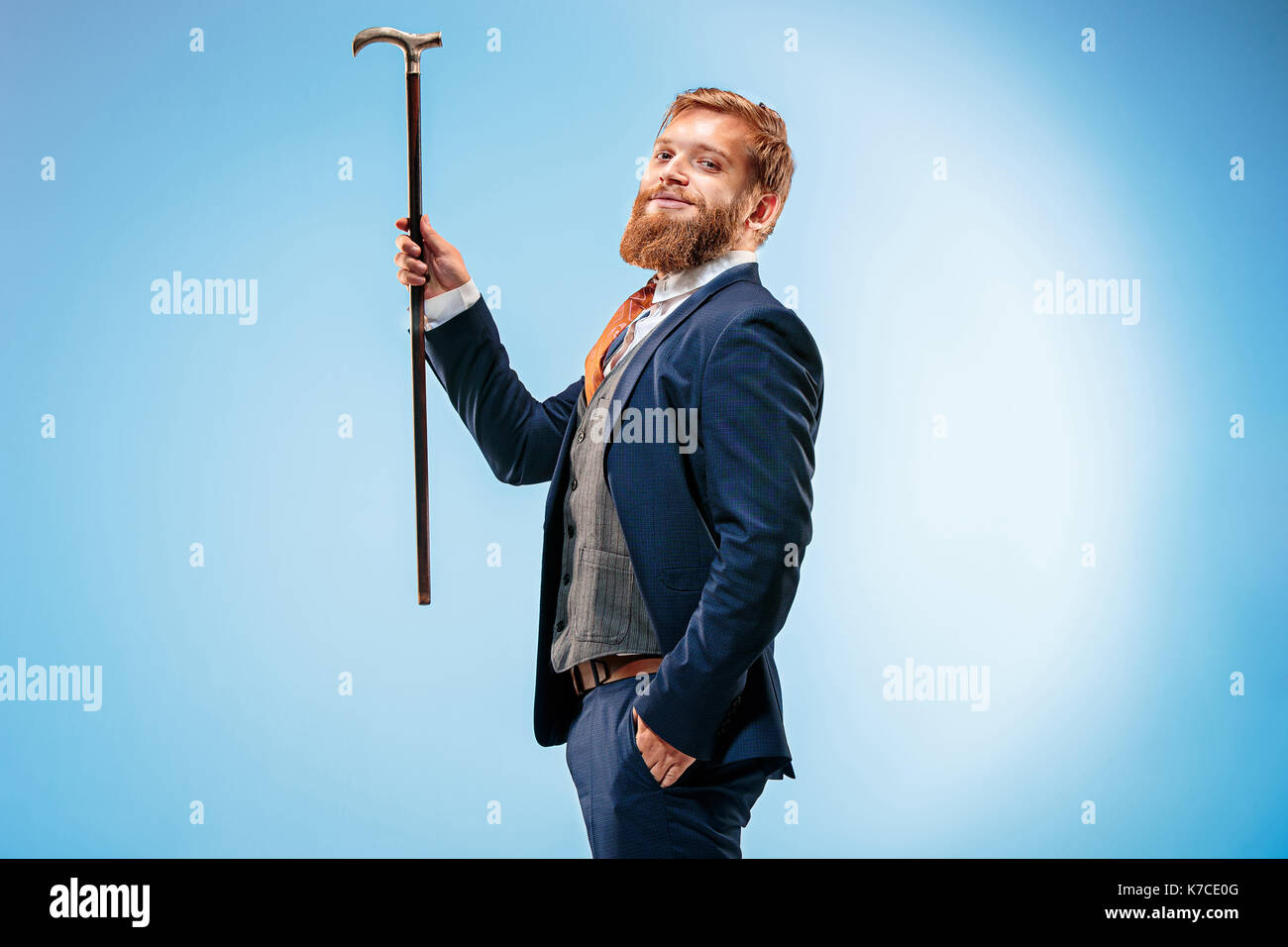 The barded man in a suit holding cane Stock Photo - Alamy