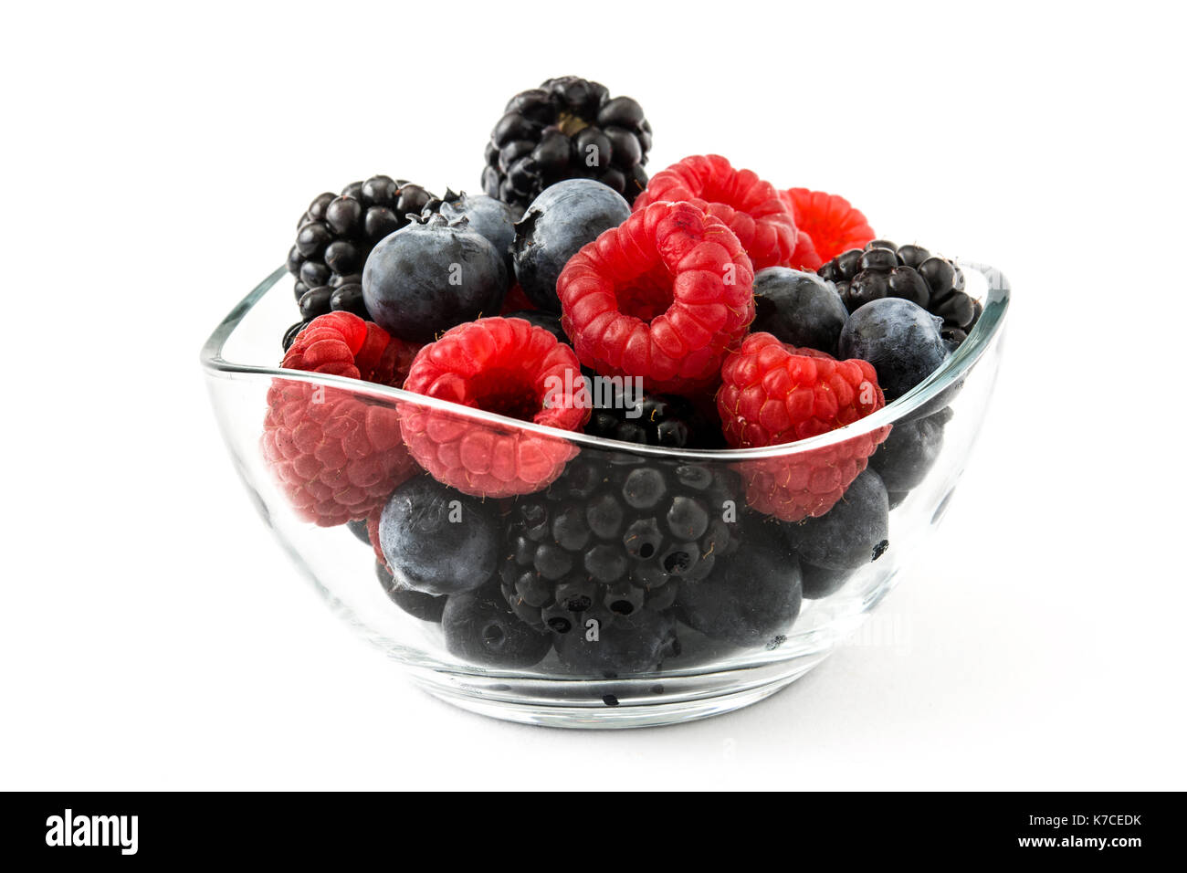 Healthy berries in crystal bowl on wooden table Stock Photo - Alamy