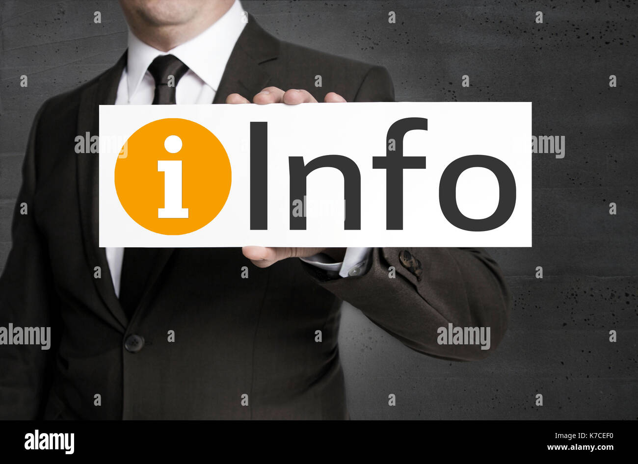 Info sign is held by businessman Stock Photo - Alamy