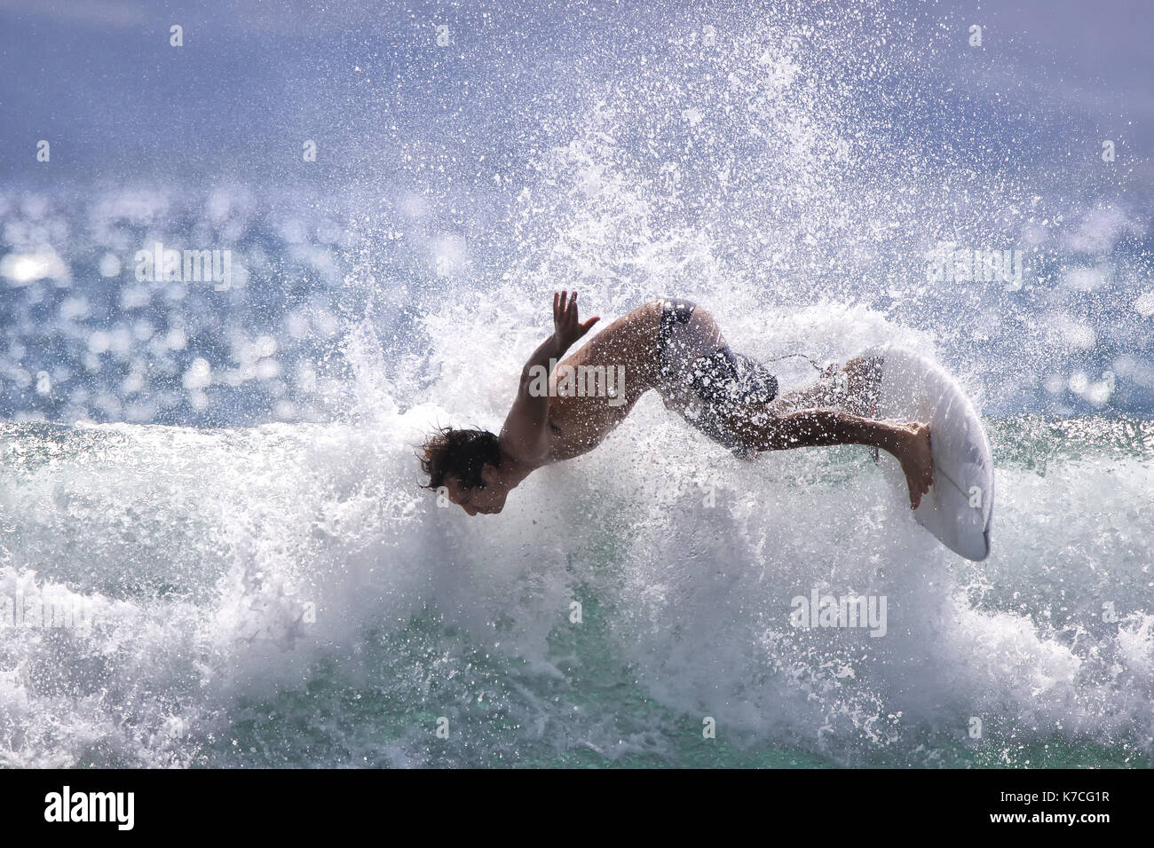 Extreme action surfing at breakwall in Lahaina on Maui Stock Photo - Alamy