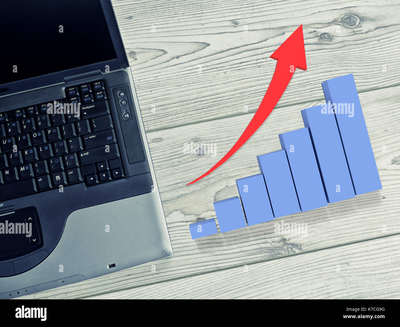 top view laptop with increasing bar chart blocks on wooden table Stock ...