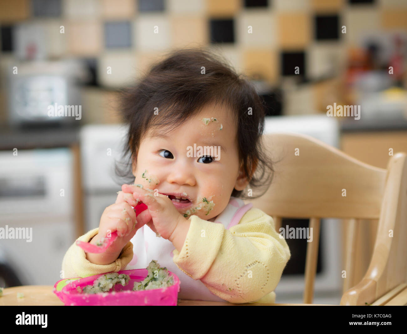 baby eating messy mashed potato Stock Photo - Alamy