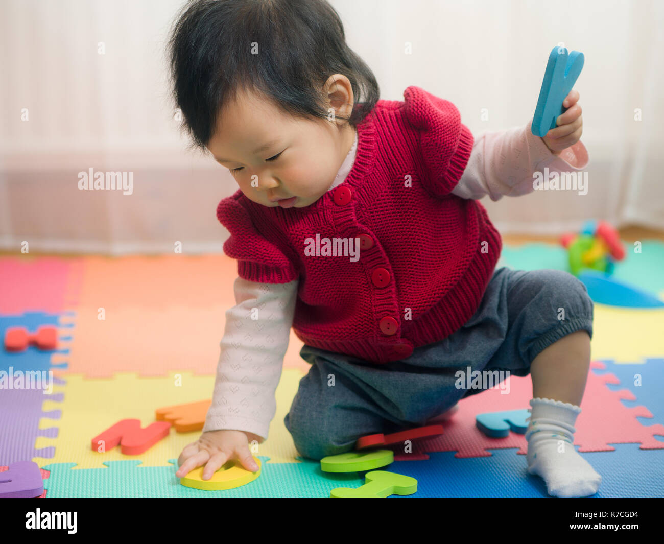 baby girl learning letters Stock Photo - Alamy