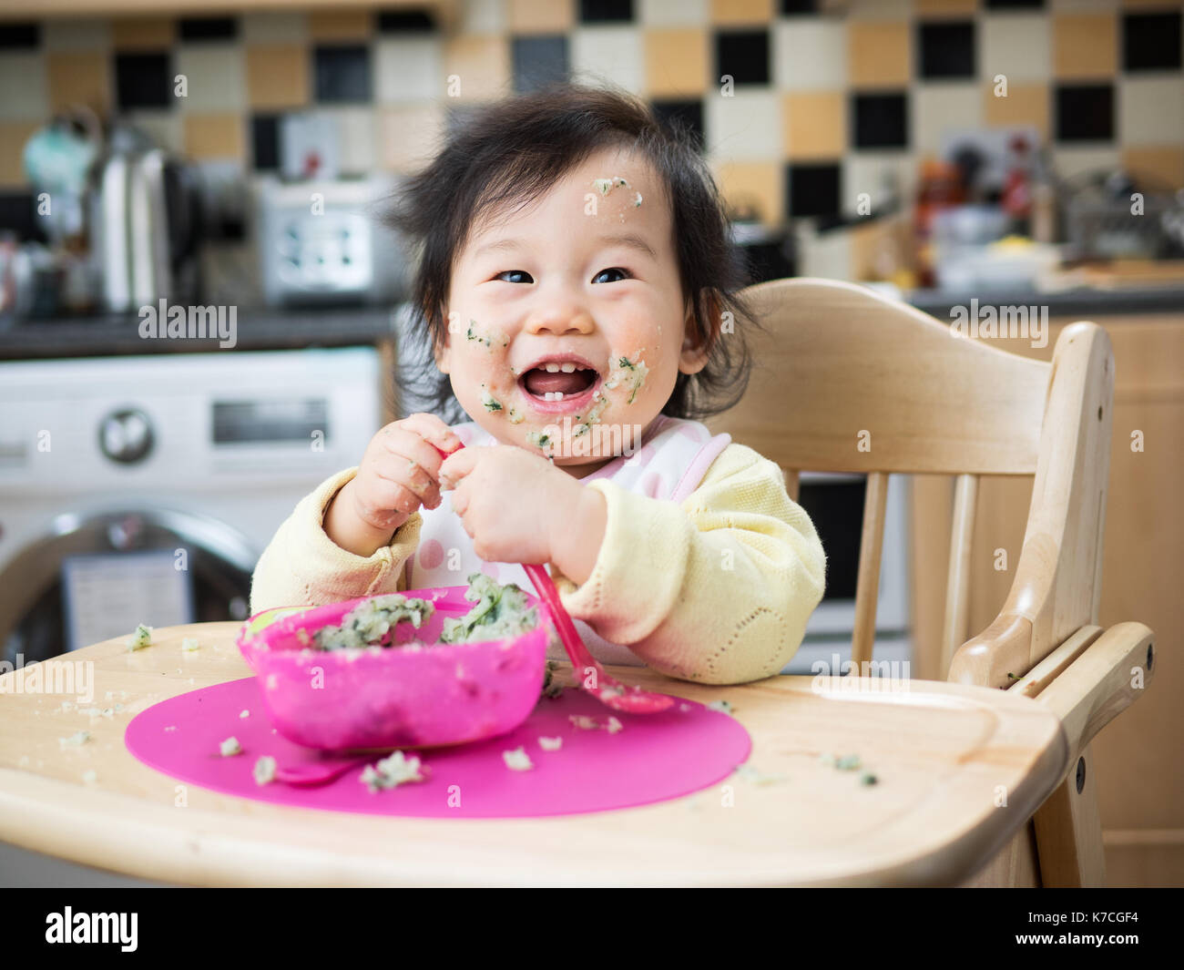 baby eating messy mashed potato Stock Photo - Alamy