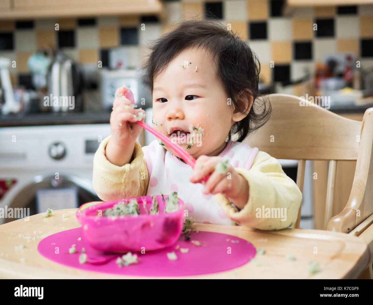 baby eating messy mashed potato Stock Photo - Alamy