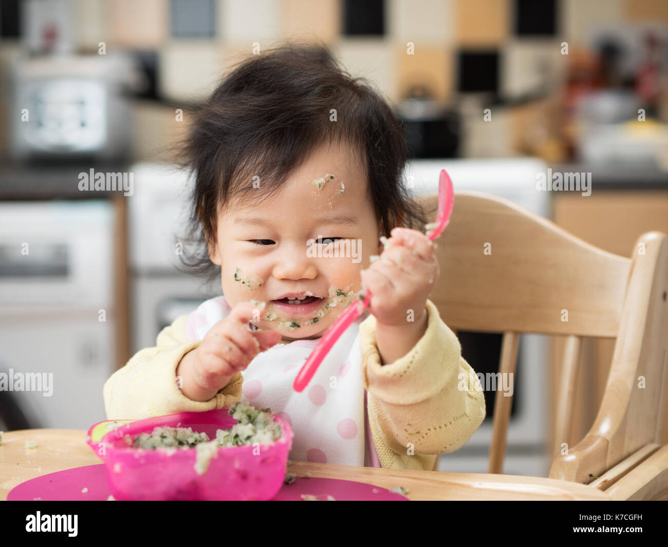 baby eating messy mashed potato Stock Photo - Alamy