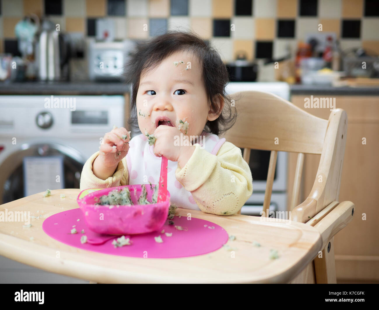 baby eating messy mashed potato Stock Photo - Alamy