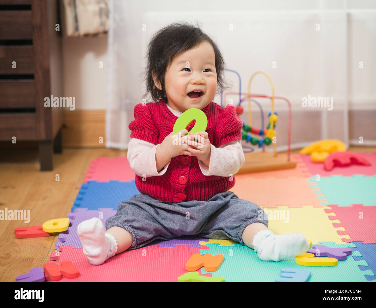 baby girl learning letters Stock Photo - Alamy