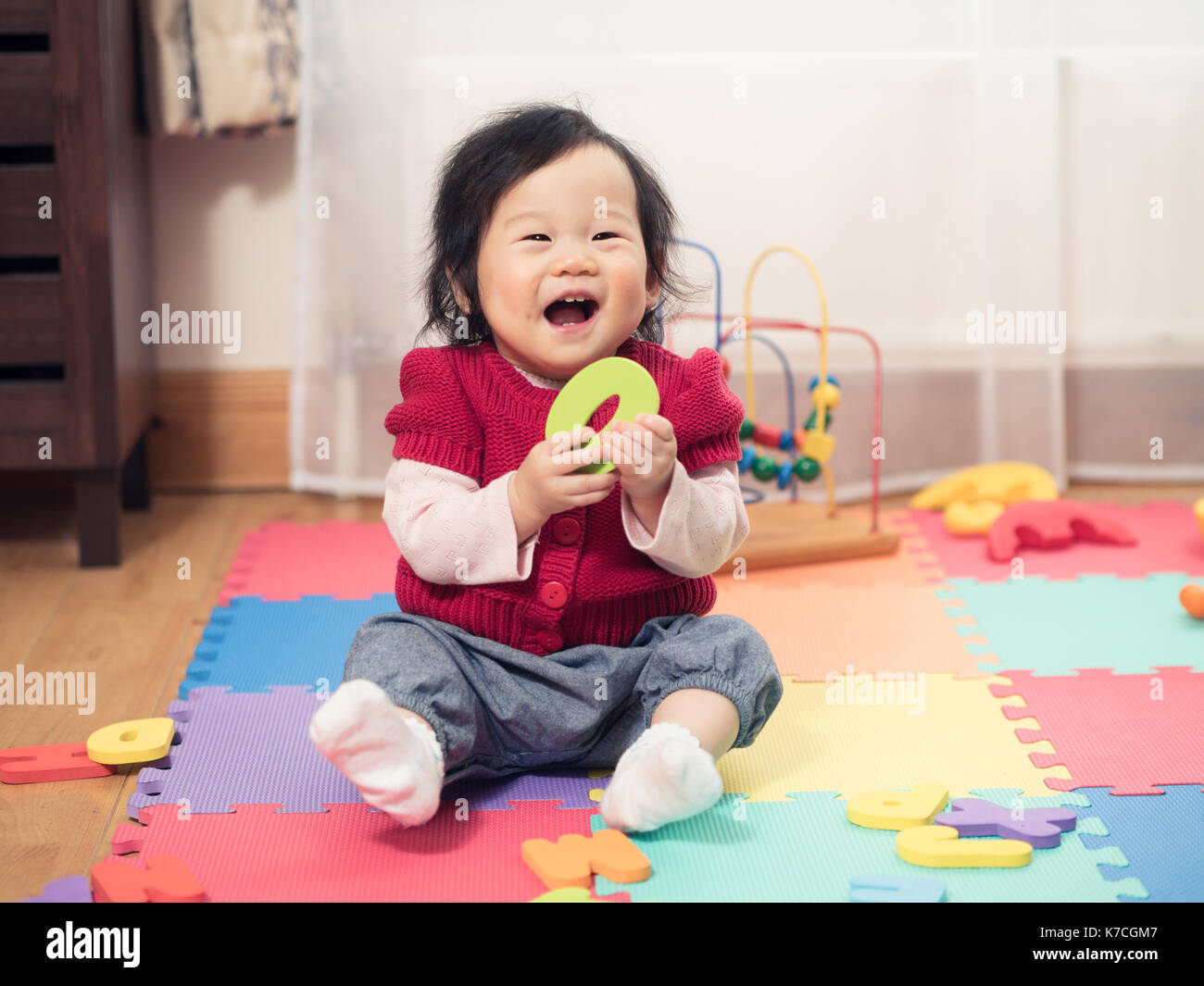 baby girl learning letters Stock Photo - Alamy