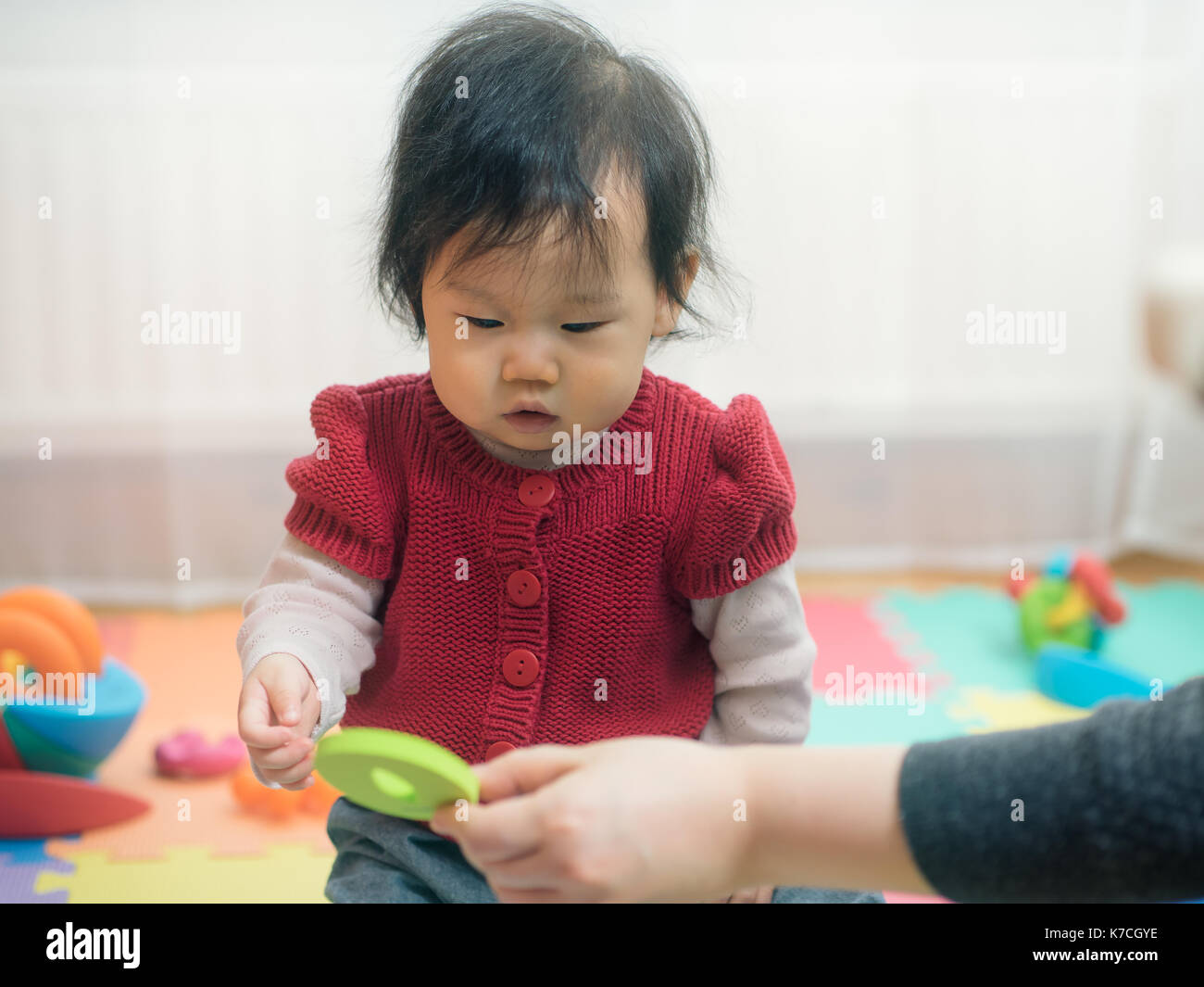 baby girl learning letters Stock Photo - Alamy