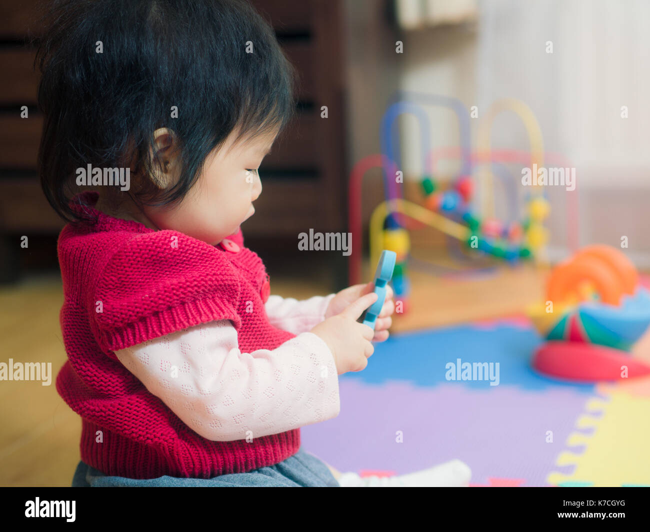 baby girl learning letters Stock Photo - Alamy
