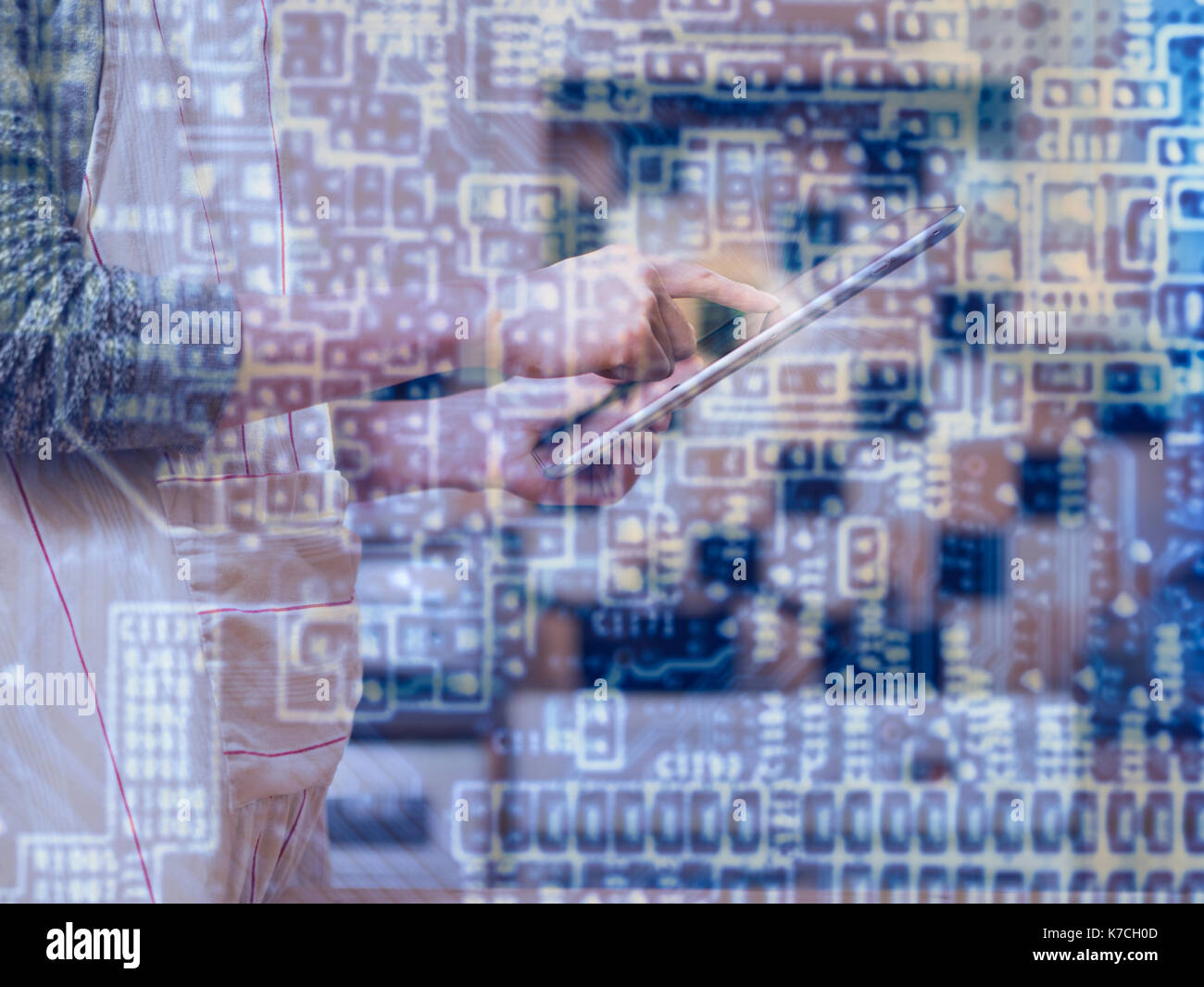 using tablet with PCB board texture Stock Photo - Alamy