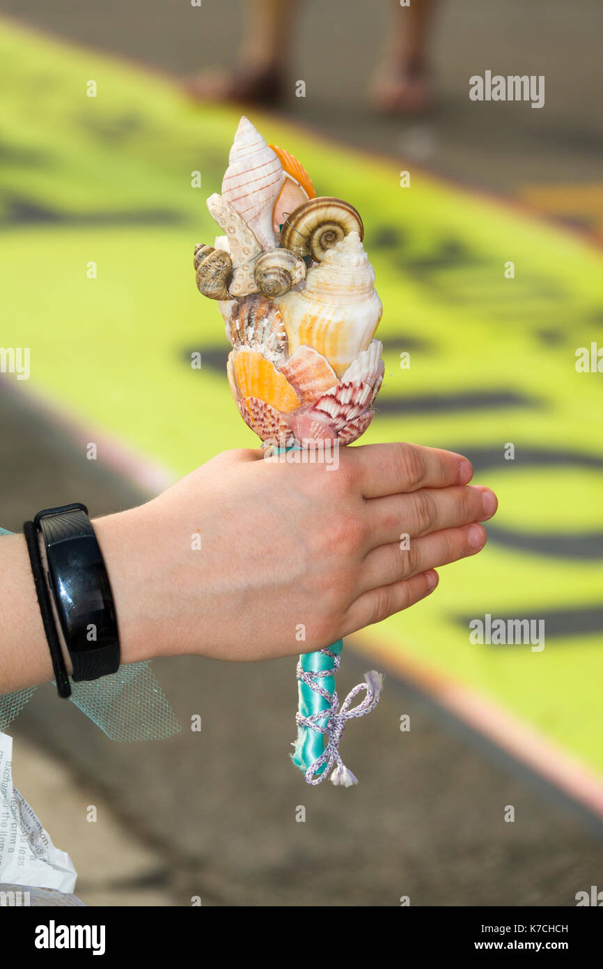 Hand holding a staff made of sea shells Stock Photo - Alamy