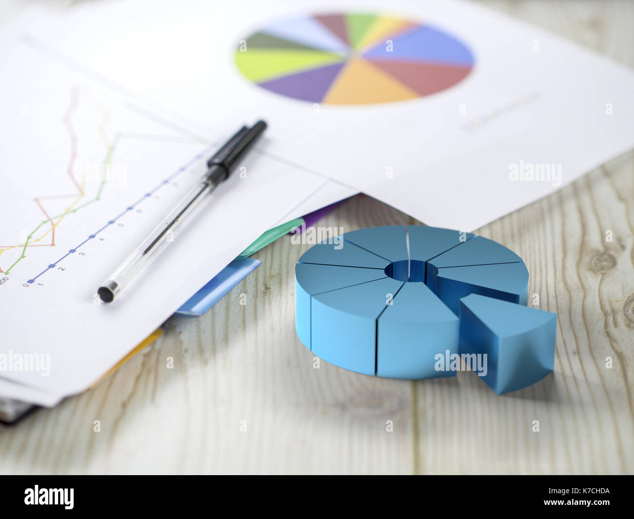 pen and notebook with pie chart Stock Photo - Alamy