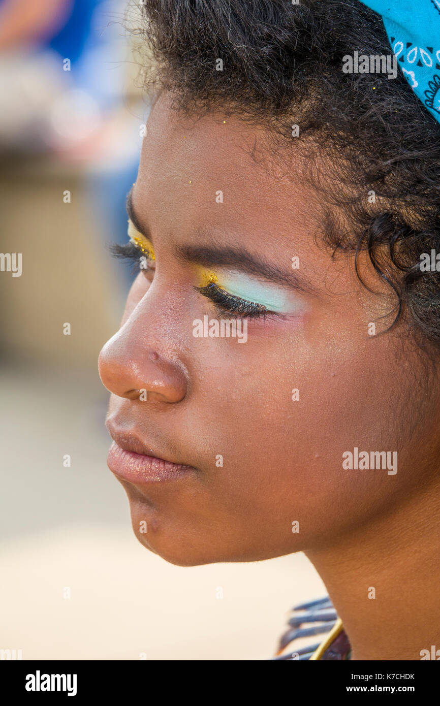 Colorful and beautiful young woman model posing as a human manikin ...
