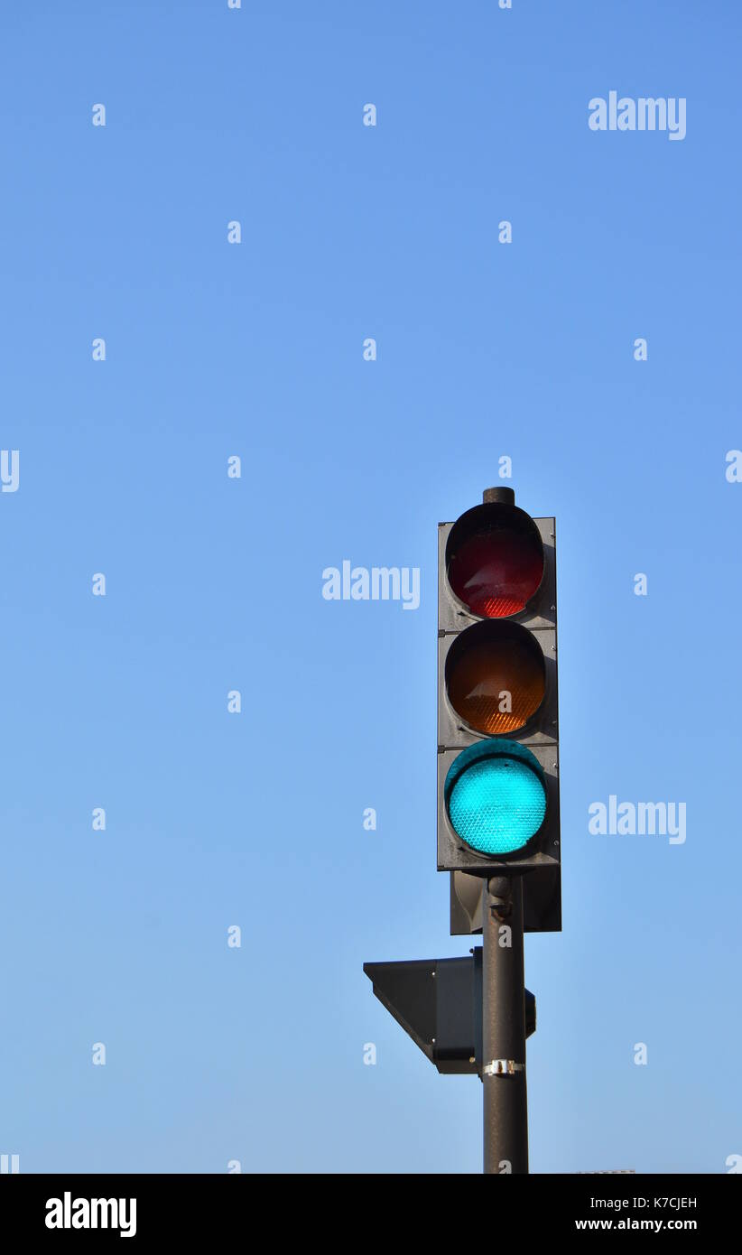 generic traffic signal against a pale blue sky. large copy space Stock ...