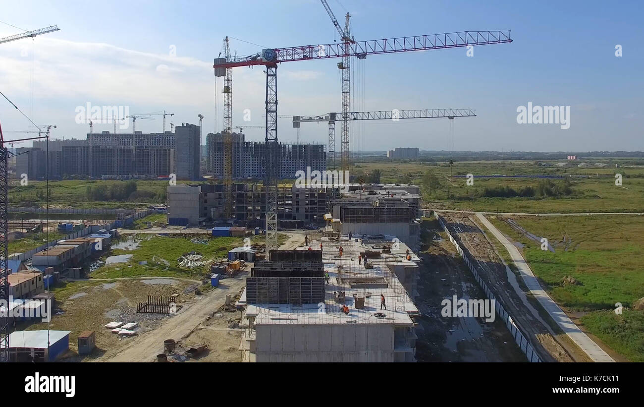 Aerial view on construction building. Construction site workers, aerial ...