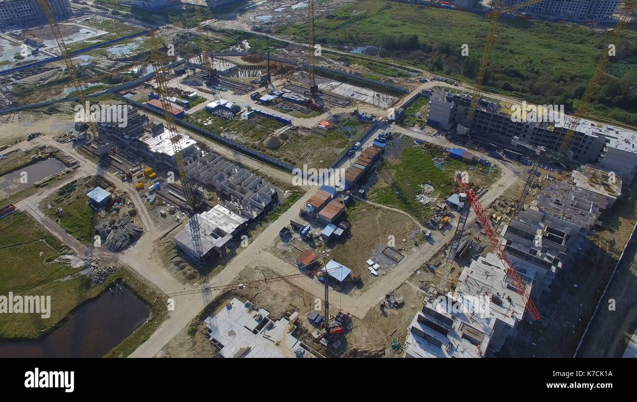 Aerial view on construction building. Construction site workers, aerial ...