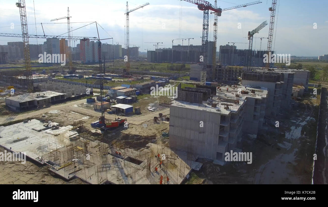 Aerial view on construction building. Construction site workers, aerial ...